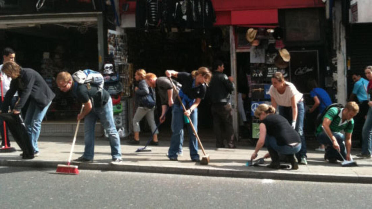 Fighting back with brooms: London citizens clean up after the riots