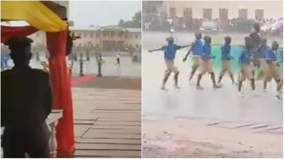 In Cameroon, children perform in rain for officials keeping dry